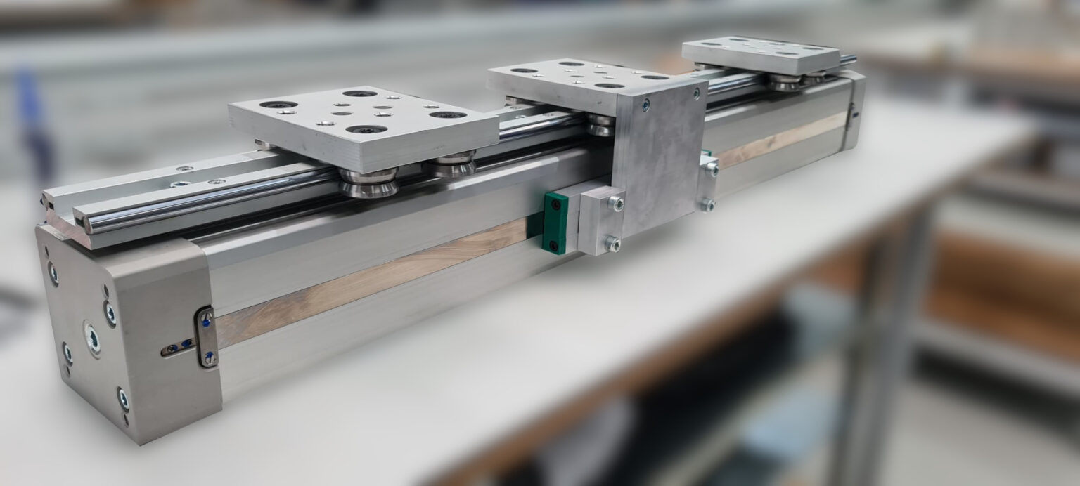 Zuigerstangloze cilinder met loopwielgeleiding - Almotion B.V.